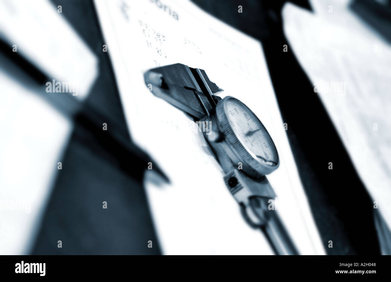 Caliper pen and pad on work table Stock Photo - Alamy
