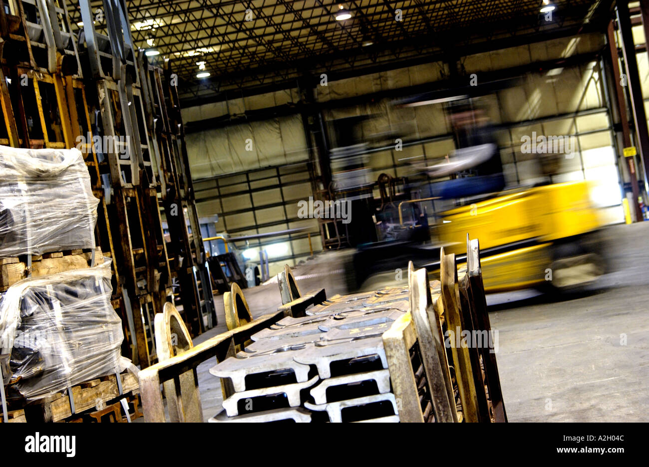 Forklift moving in factory Stock Photo - Alamy