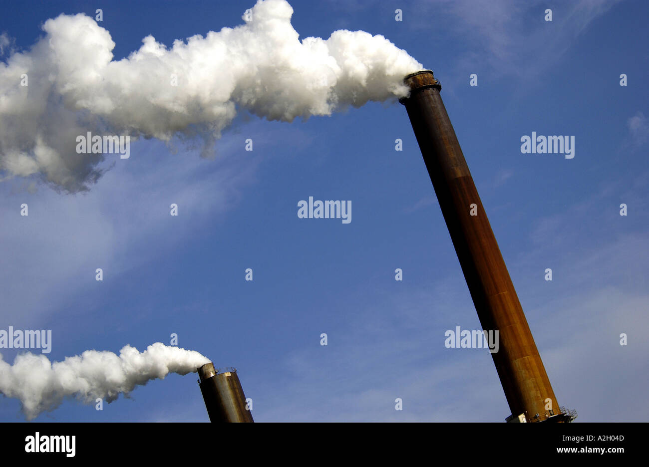 Industrial smoke stacks Stock Photo - Alamy