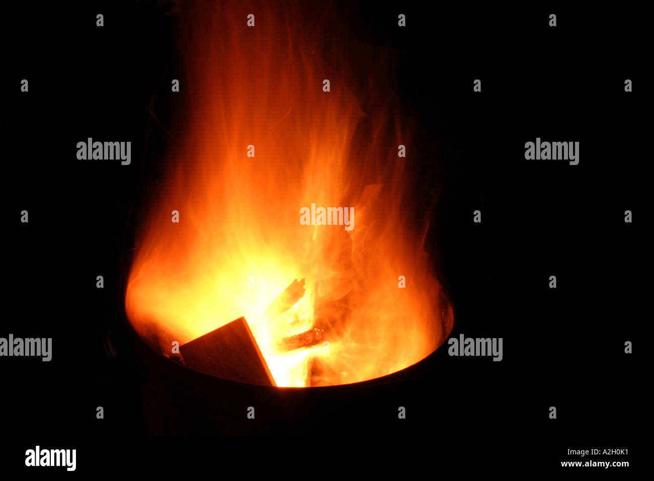 fire in an oil drum Stock Photo - Alamy