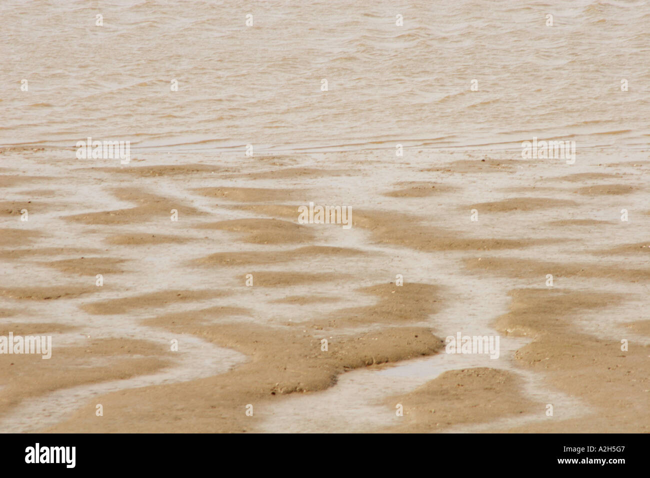 Patterns in sand on beach Stock Photo - Alamy