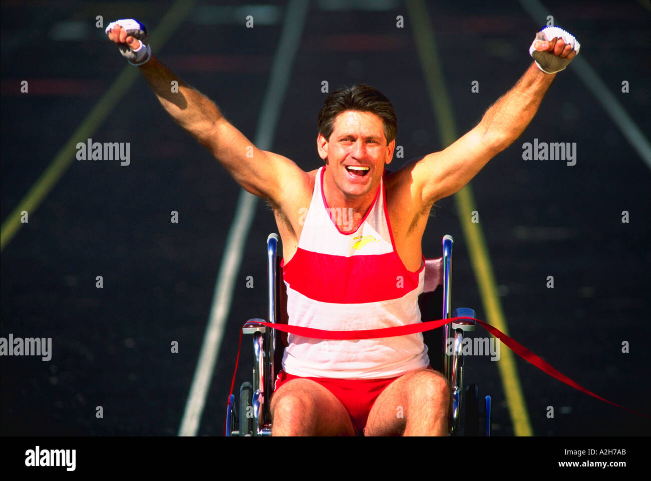Physically challenged athlete winning a race Stock Photo - Alamy