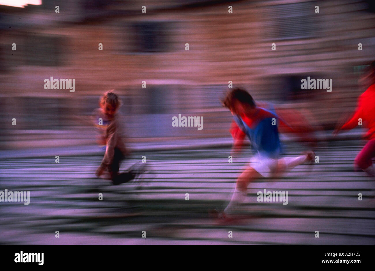 Kids playing blurred Stock Photo - Alamy