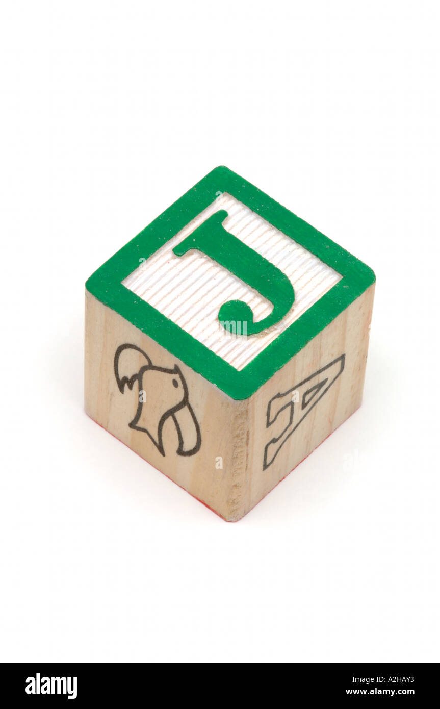 Children wooden learning block showing green alphabet J Stock Photo - Alamy