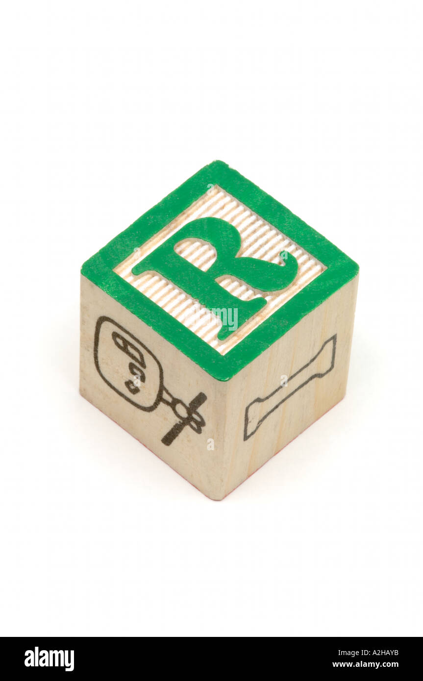 Children wooden learning block showing green alphabet R Stock Photo - Alamy