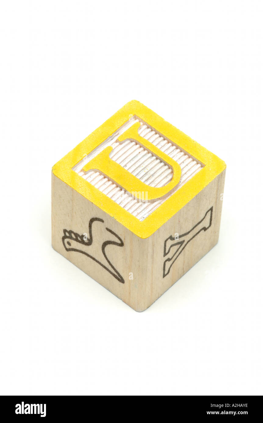 Children wooden learning block showing yellow alphabet U Stock Photo ...