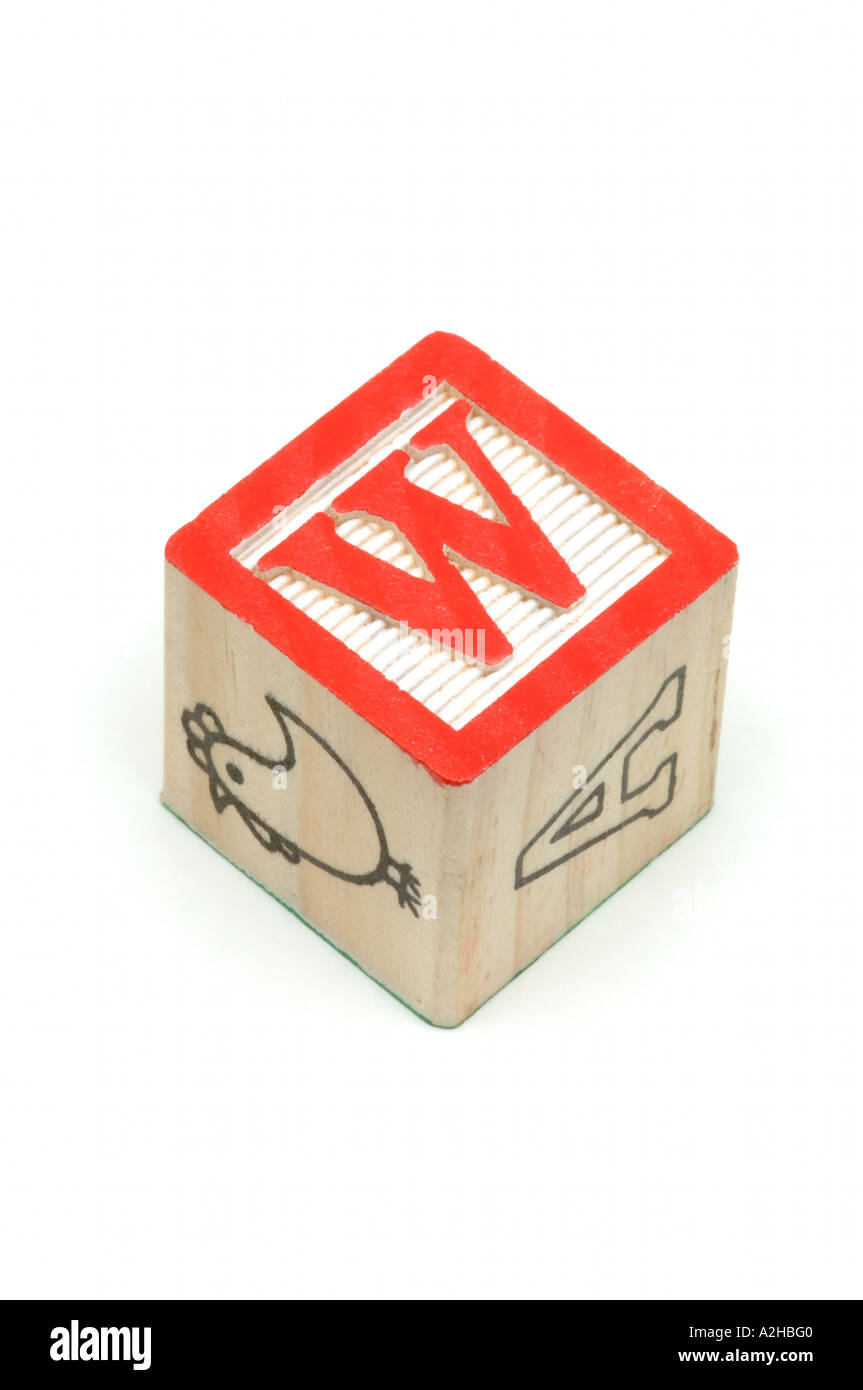 Children wooden learning block showing red alphabet W Stock Photo - Alamy