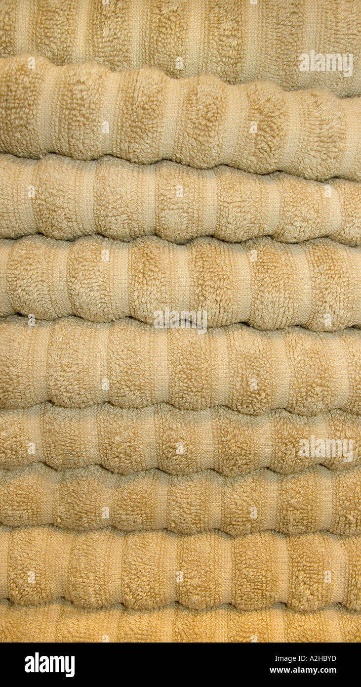 Stack of beige coloured towels England Stock Photo - Alamy