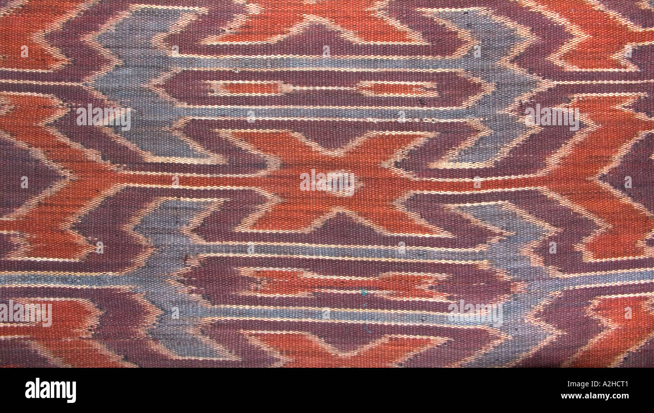 Detail of geometric motifs on hipstrap loom woven ikat decorated shawl ...