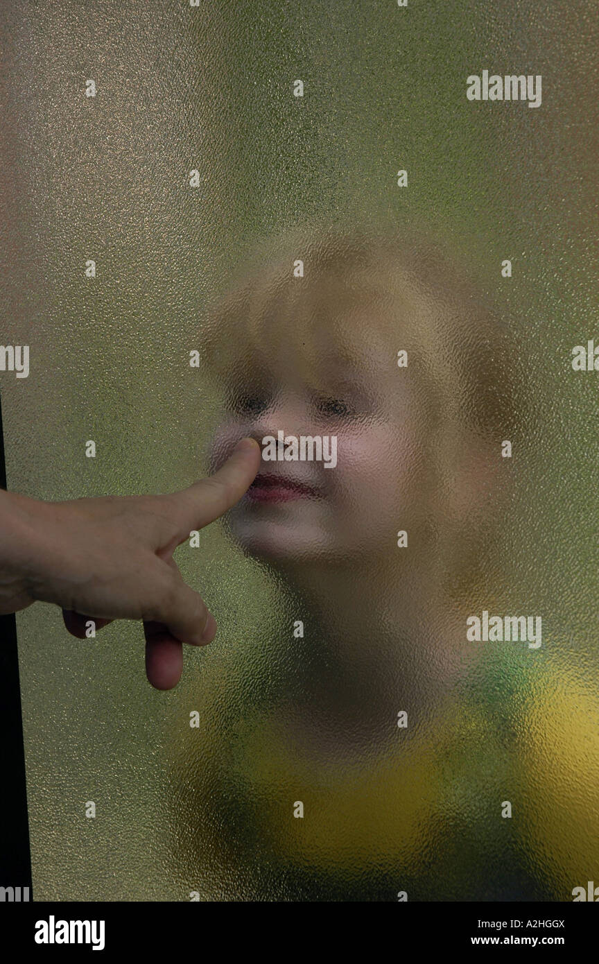 Child behind glass hi-res stock photography and images - Alamy