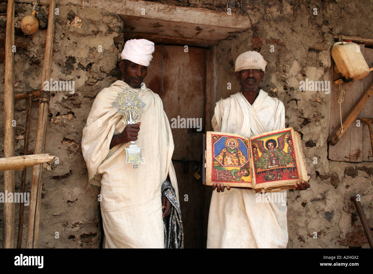 Priests display artifacts at Narga Selassie, one of the island ...