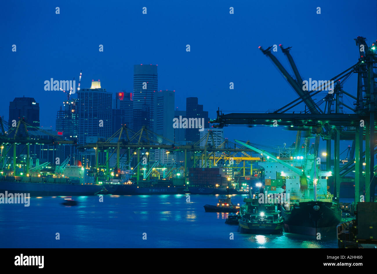 Ships loading unloading cargo Singapore Docks at night Singapore Stock ...