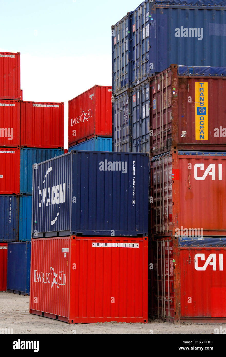 stacks of red and blue shipping containers Stock Photo - Alamy