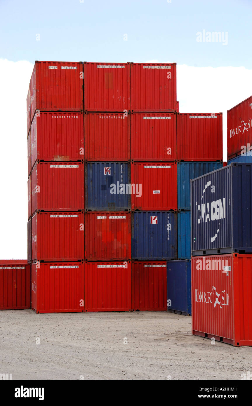 stacks of red and blue shipping containers Stock Photo - Alamy
