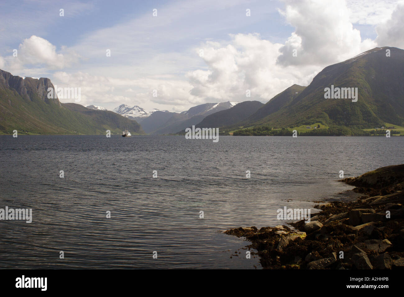 Mountain view with ferry crossing a fjord, Norway Stock Photo - Alamy