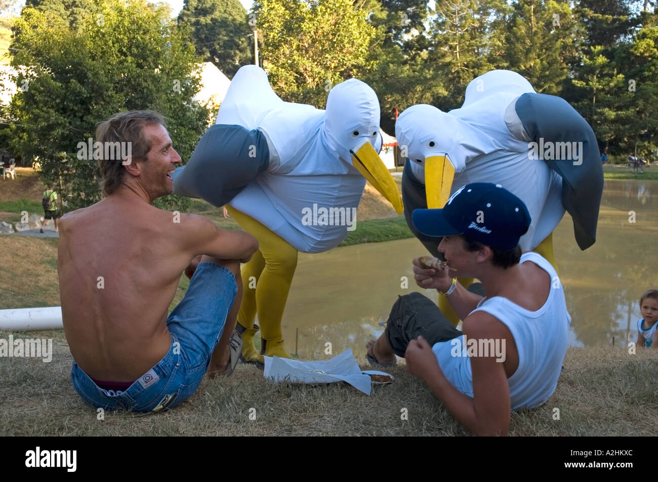 Street performers in bird costumes with eating men at Woodford Folk ...