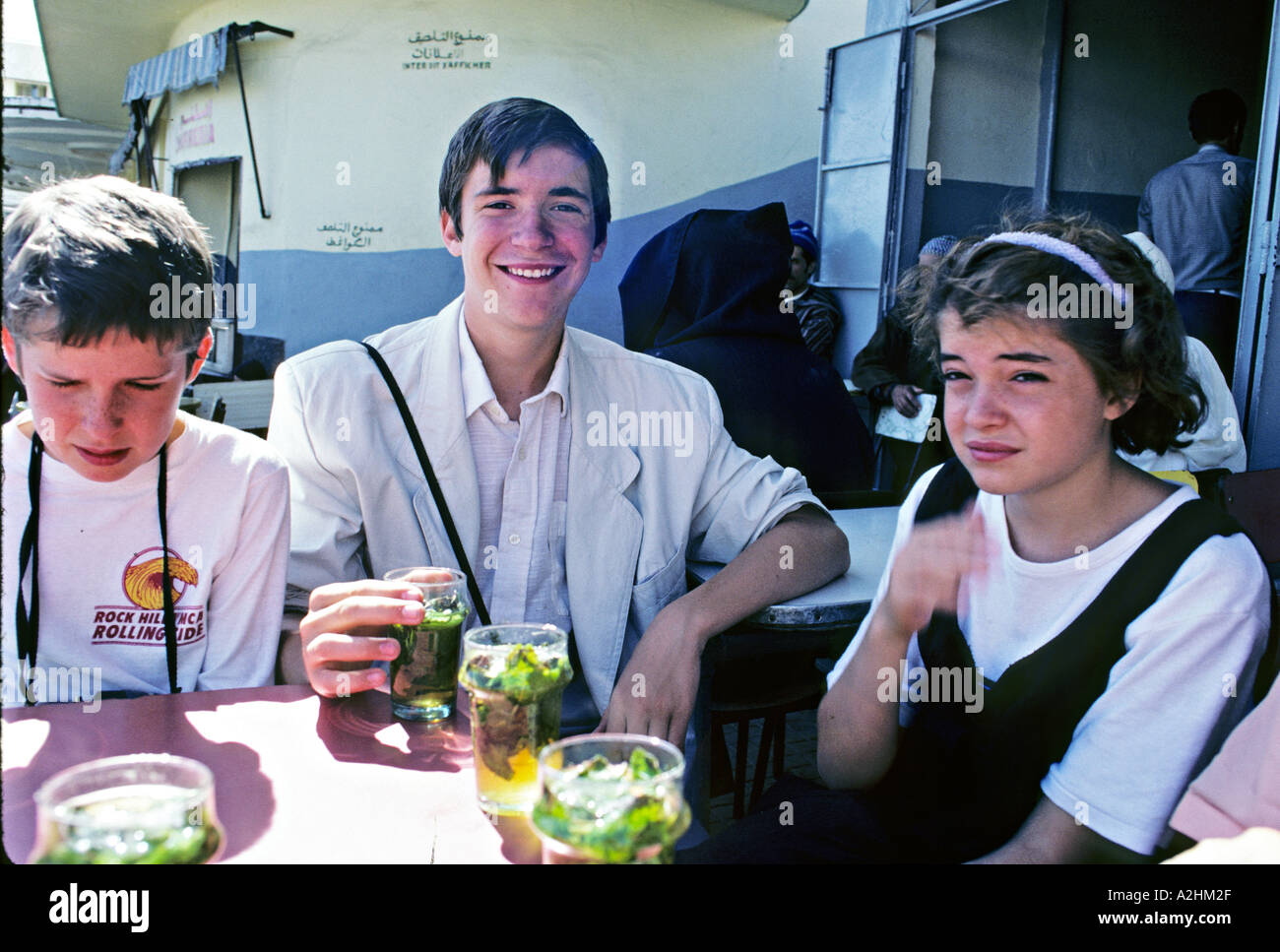 AFRICA MOROCCO TANGIER North American children trying Moroccan mint tea ...