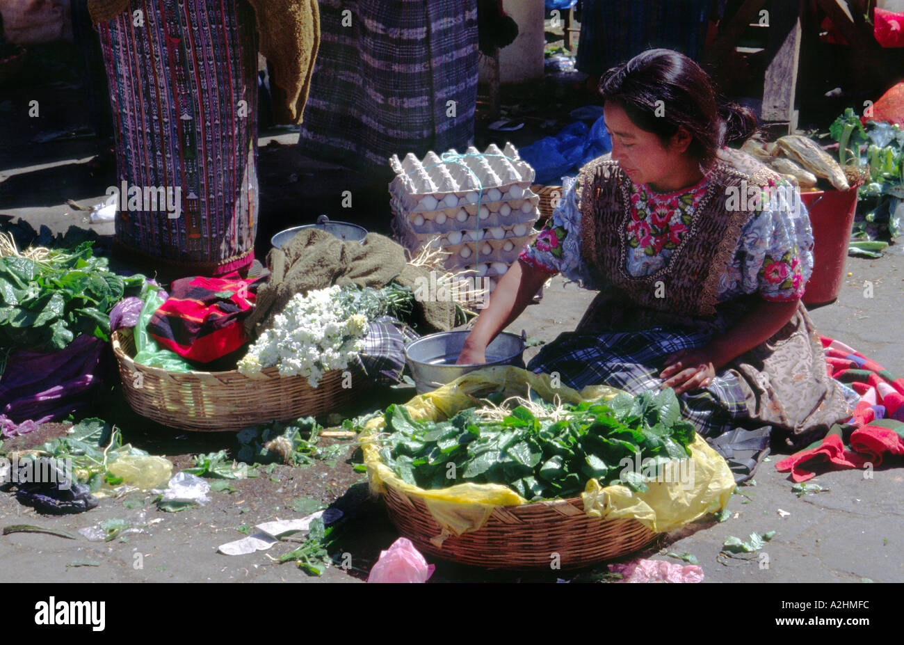 Woman selling vegetables at Almolonga Market near Quetzaltenango in ...