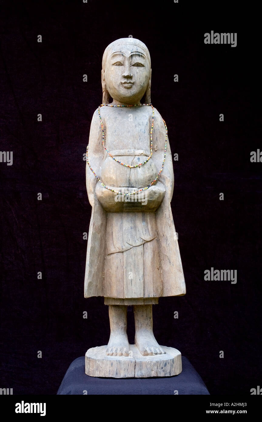 Jizo style carved wooden Buddhist statue of a monk with a begging bowl ...