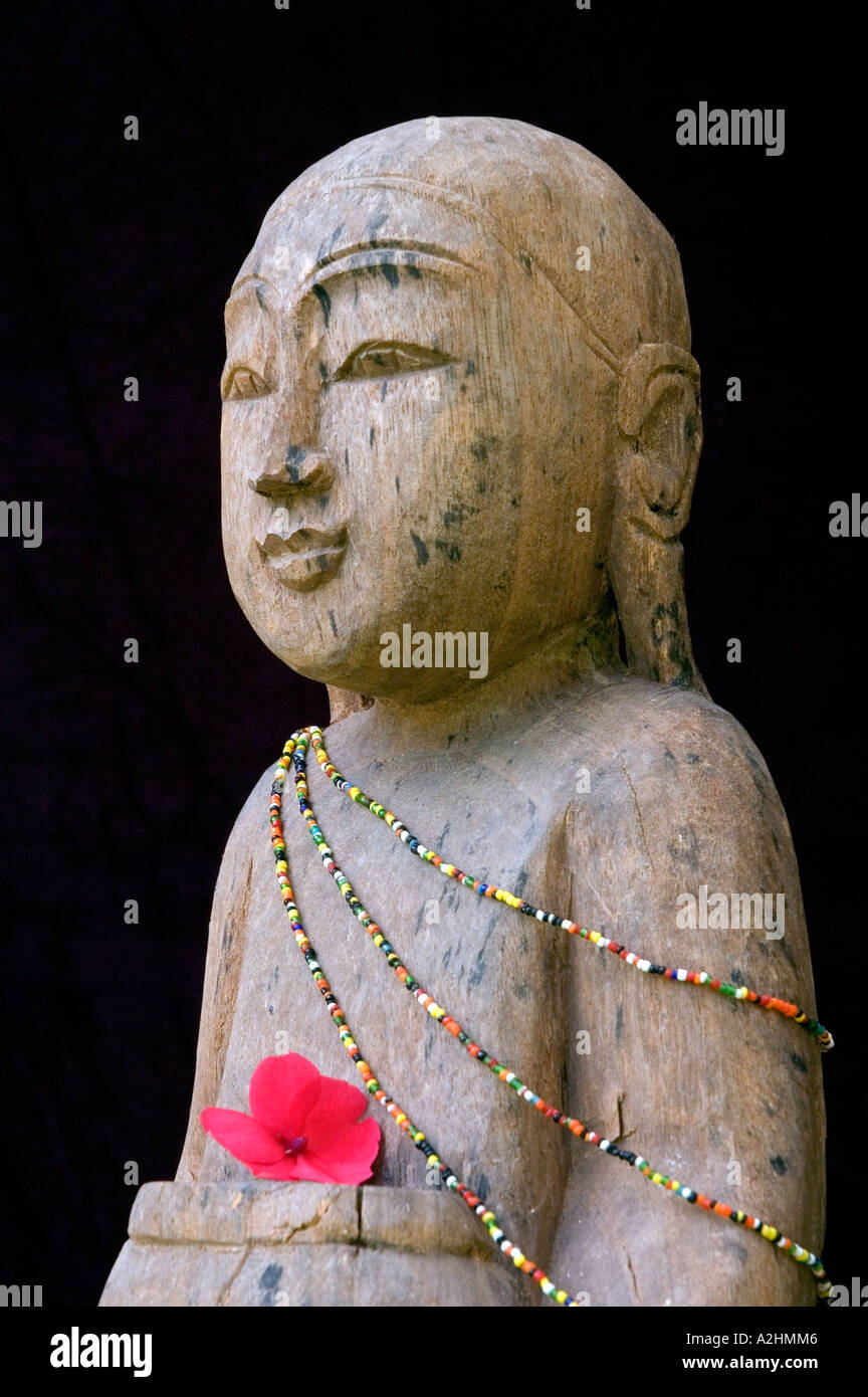 Jizo style carved wooden Buddhist statue of a monk with a begging bowl ...