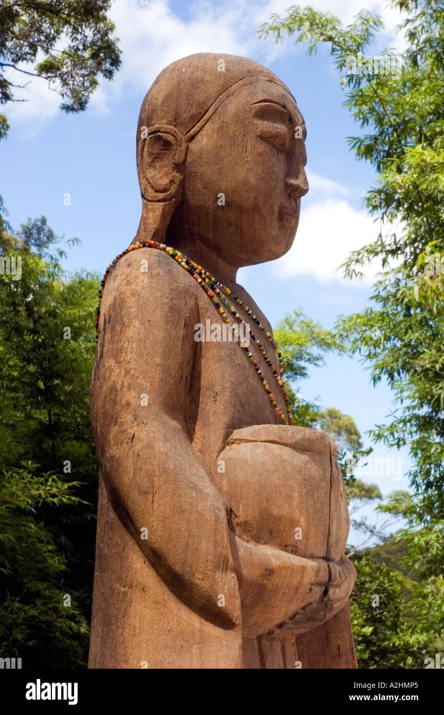 Jizo style carved wooden Buddhist statue of a monk with a begging bowl ...