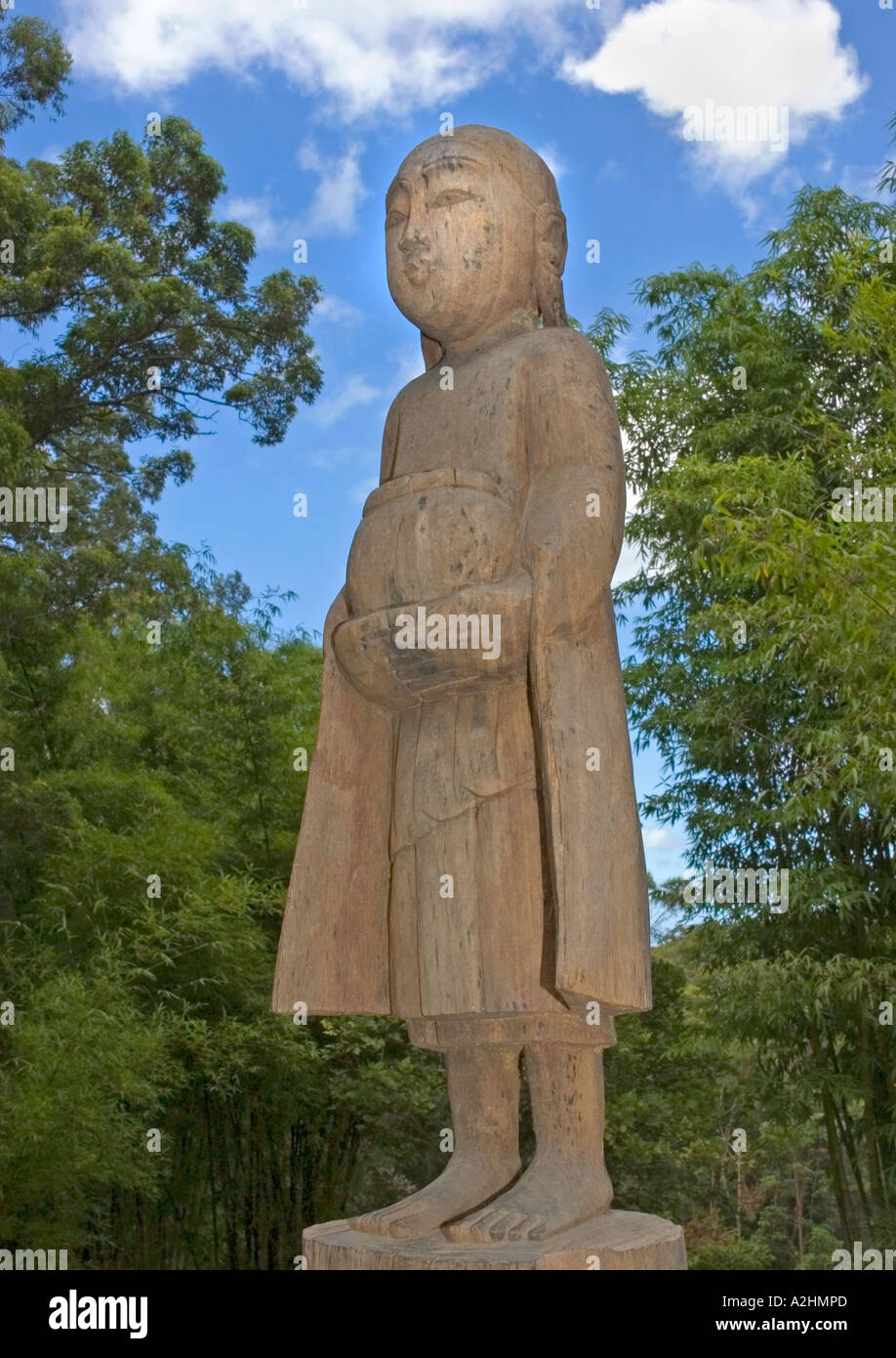 Jizo style carved wooden Buddhist statue of a monk with a begging bowl ...