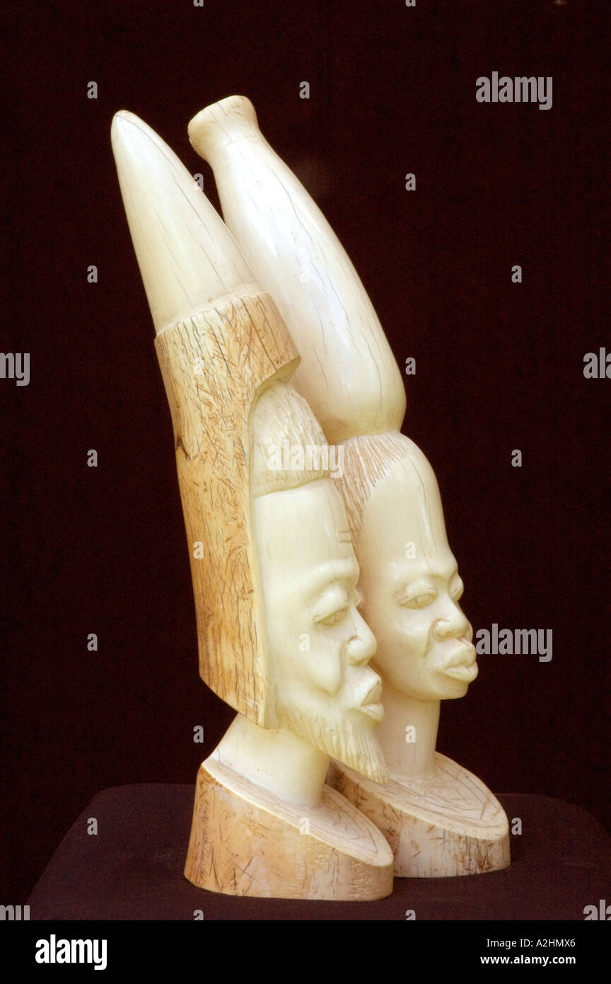 Carved ivory figurines of a stylised African man and woman. DSC 8195 ...