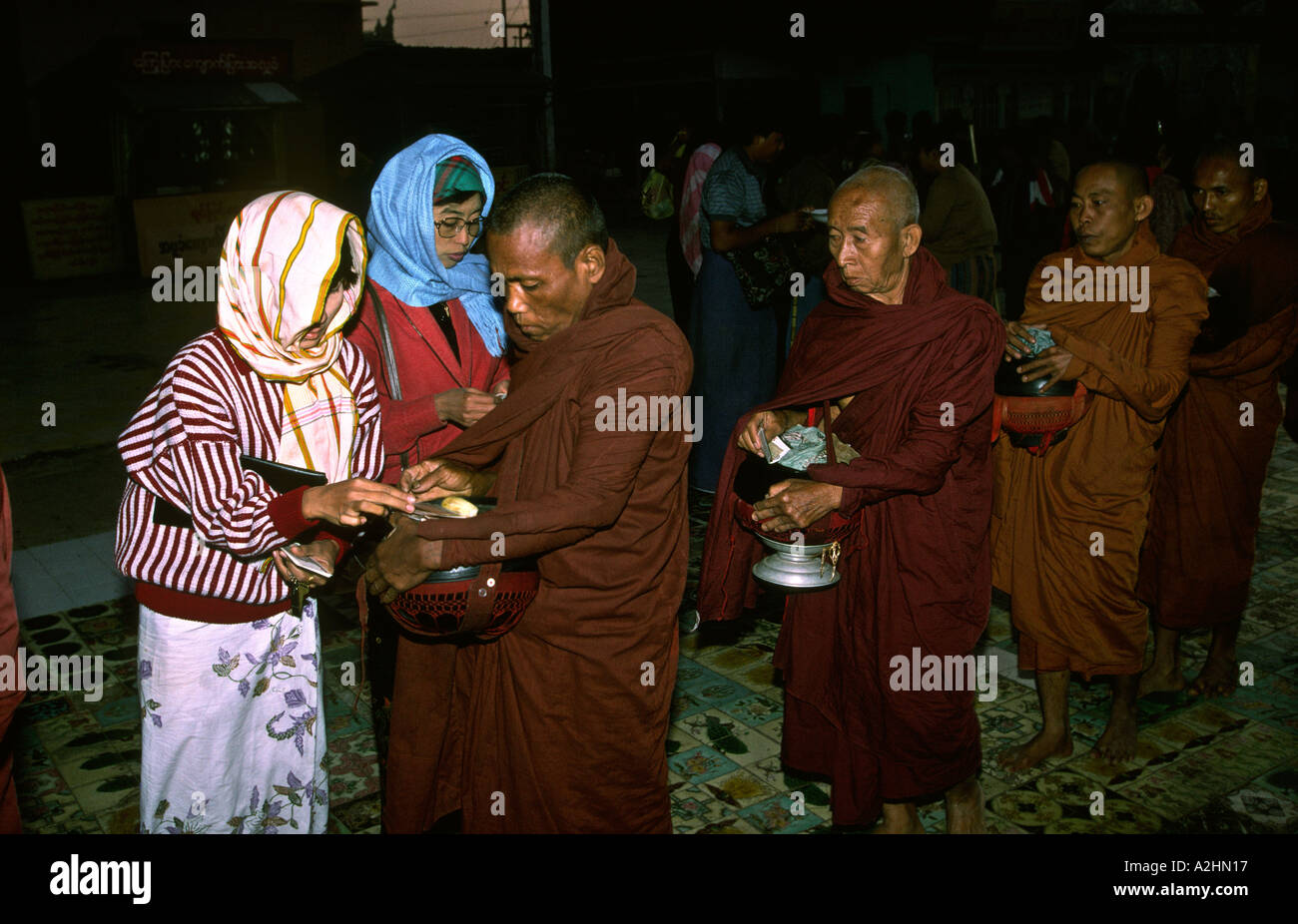 Myanmar Burma south Kyaik Hti Yo Golden Rock Pagoda monks processing ...