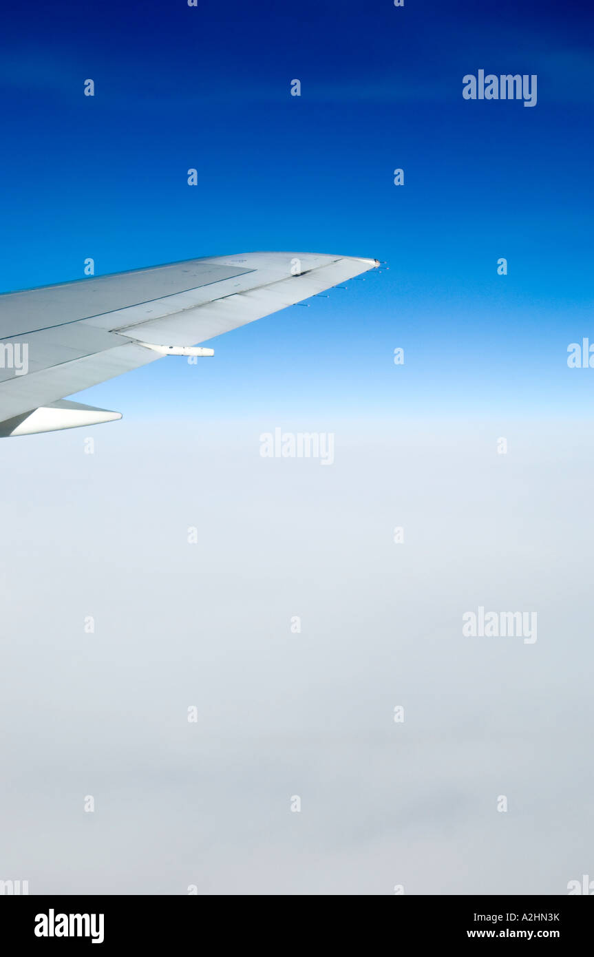 Vertical shot of a plane's wing in the air Stock Photo - Alamy