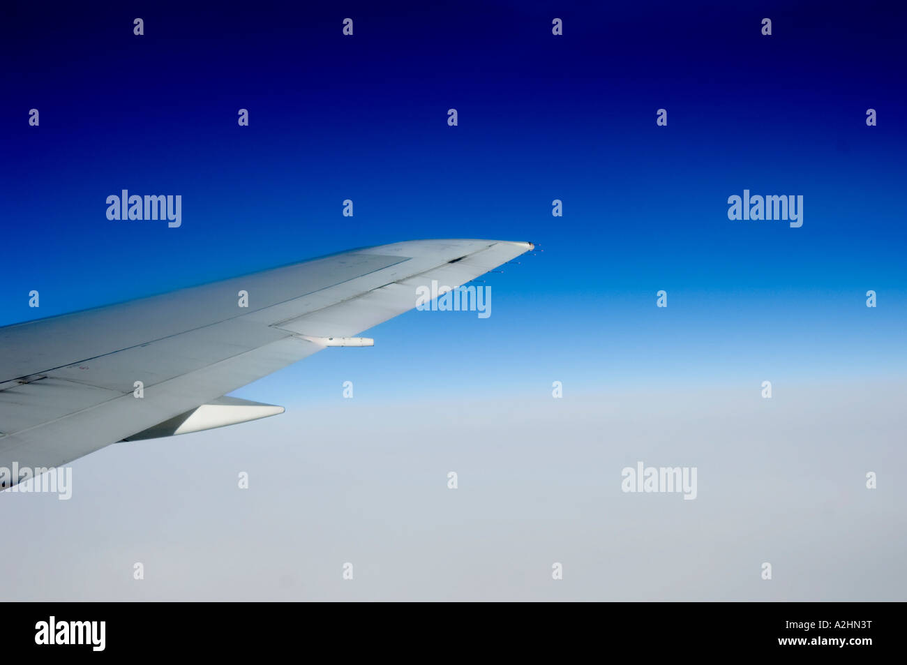 Horizontal shot of a commercial airplane's wing in the air Stock Photo ...