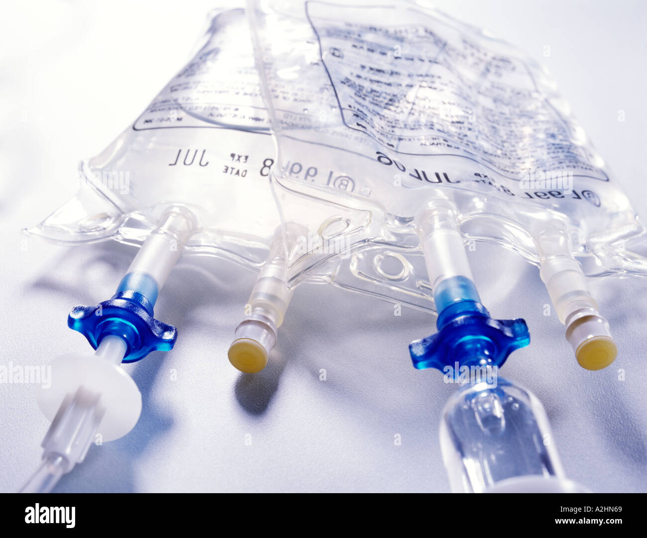 Two IV Intravenous bag with saline clear liquid solution inside with ...