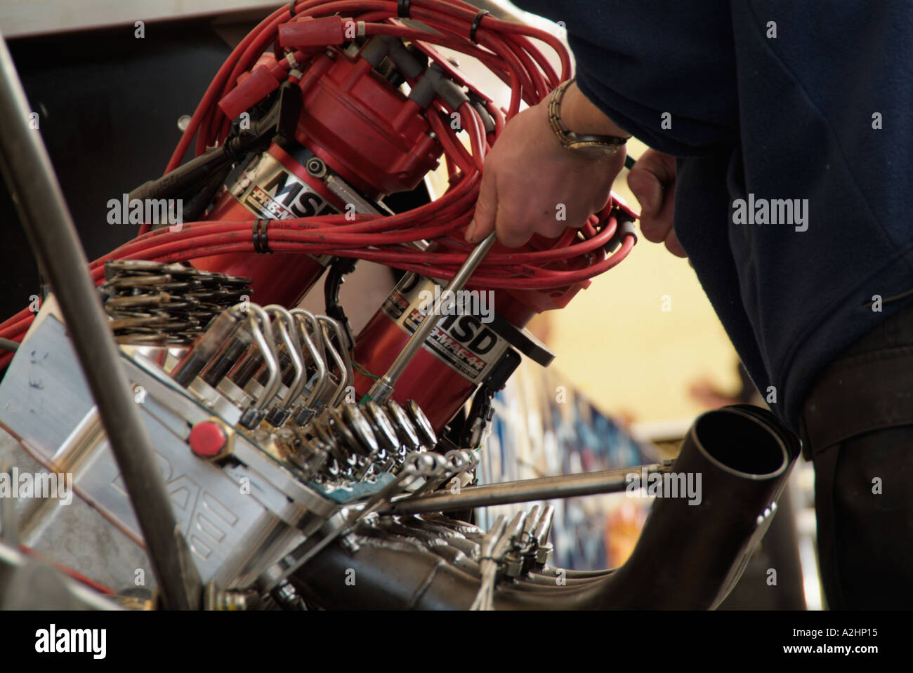 race mechanic working on the engine on a top fuel dragster Stock Photo ...