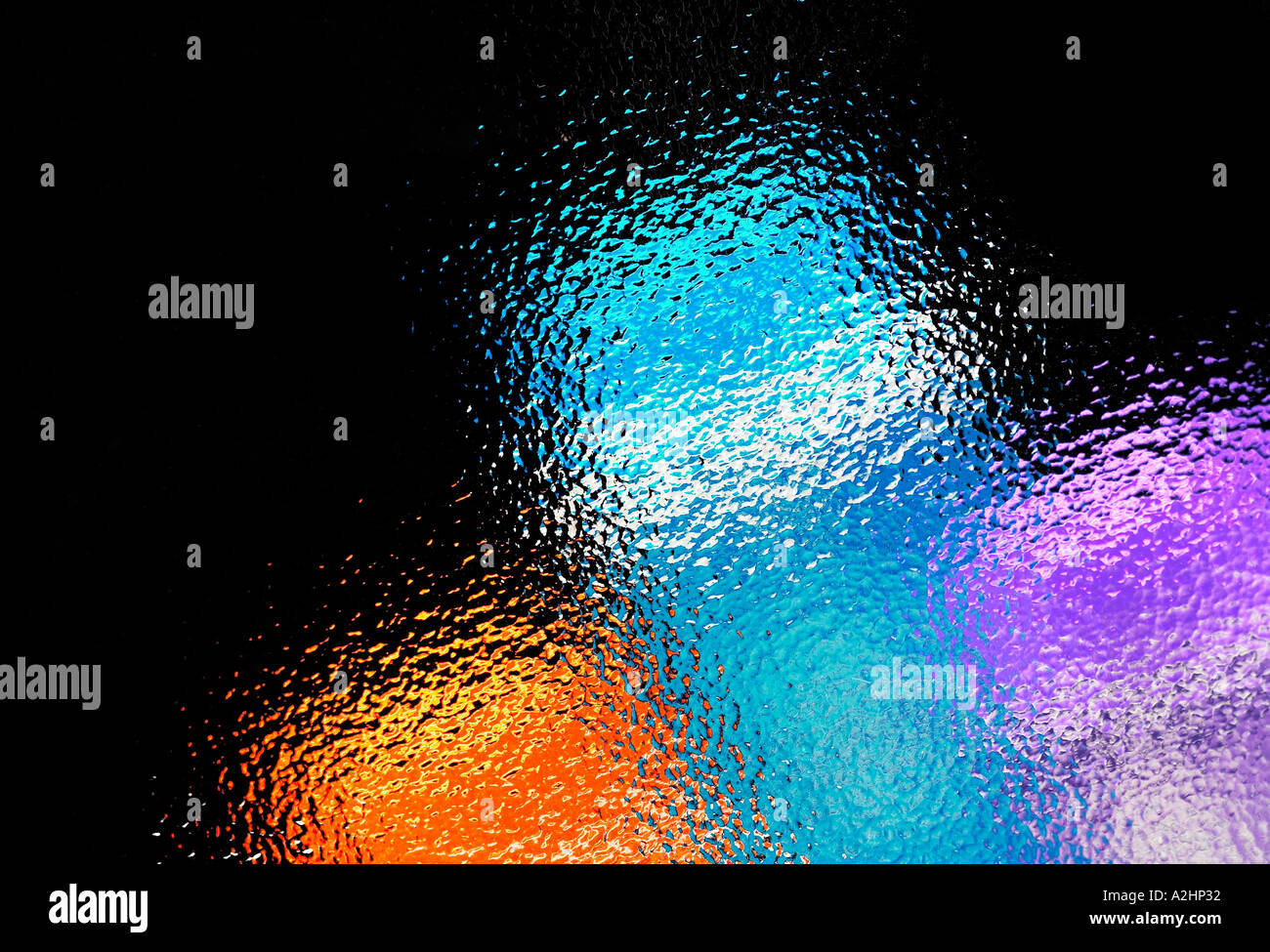 landscape shot of three vitamin bottles stood behind texture glass on a ...