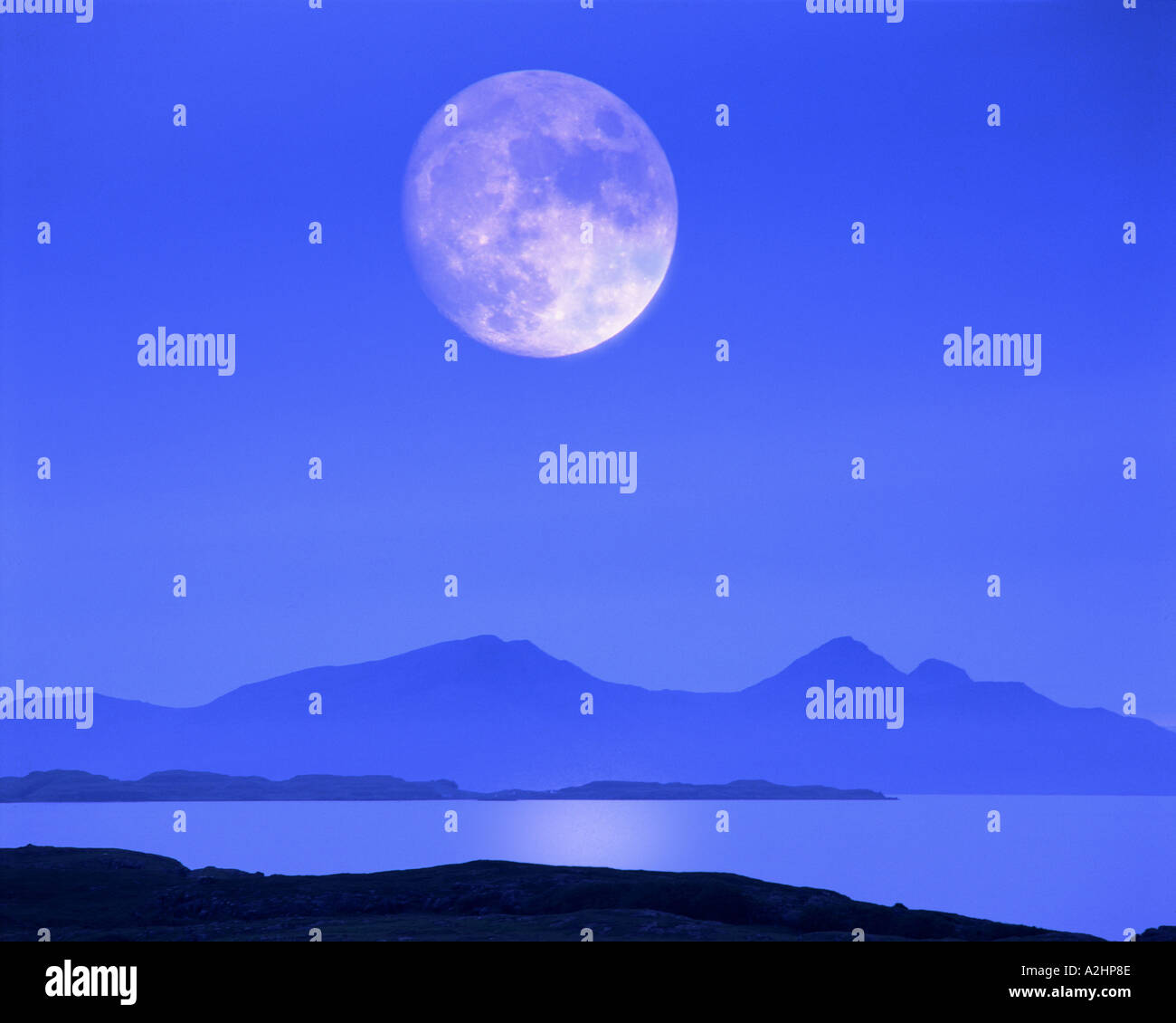 GB - SCOTLAND: Moon over the Sound of Rhum Stock Photo - Alamy