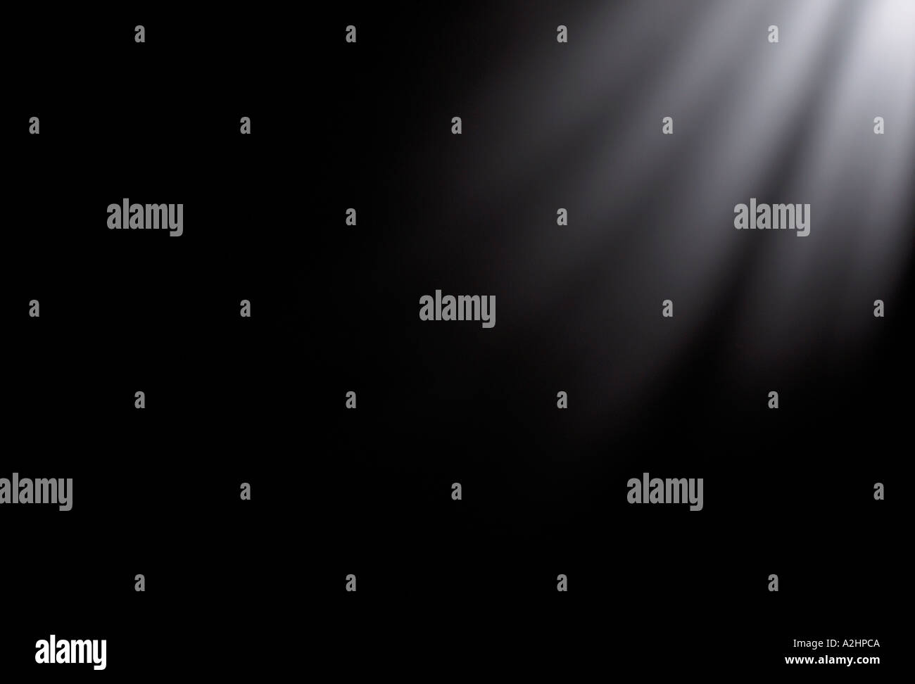 Black background with splash of directional light from top right hand ...