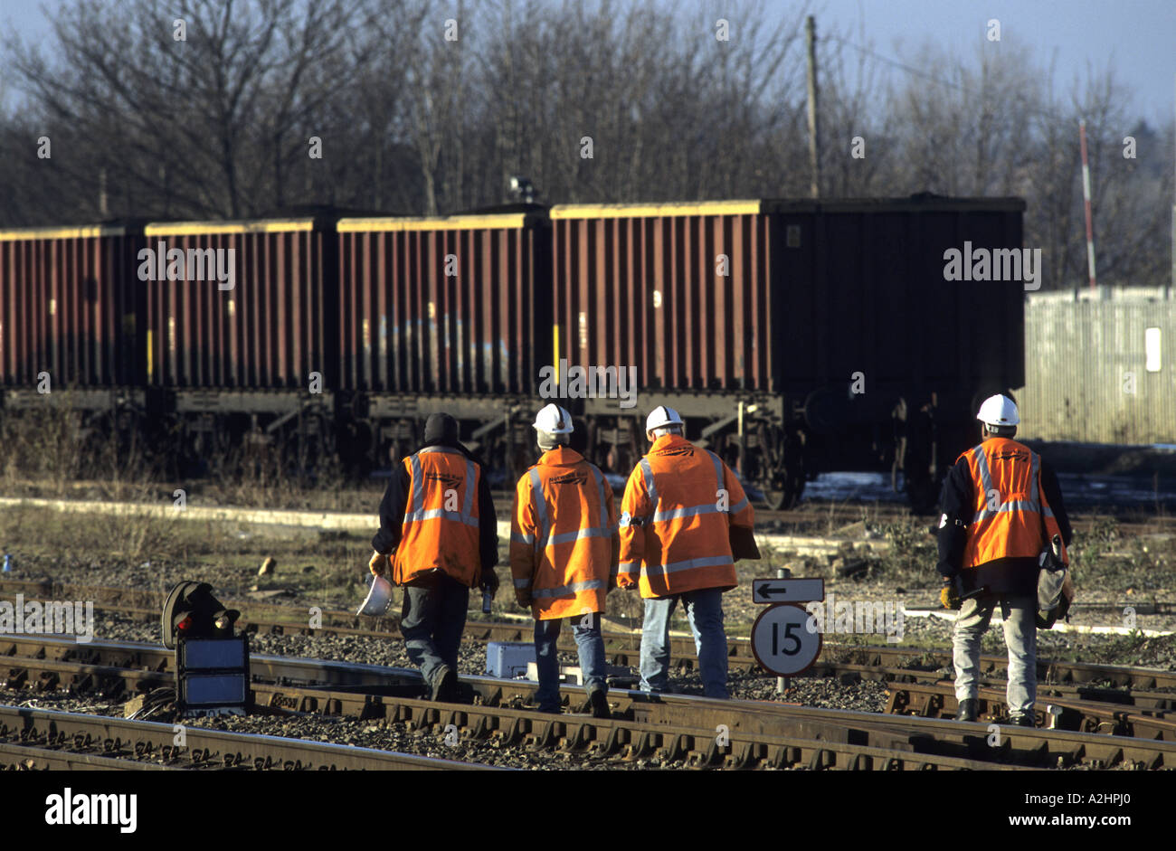 Network Rail workers walking along track at Rugby, Warwickshire ...
