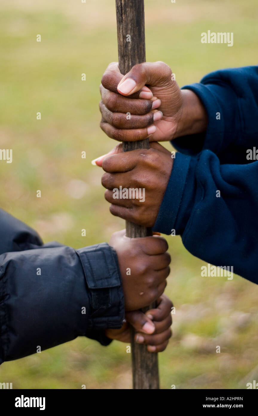 Close up of black kids hands working together Stock Photo - Alamy
