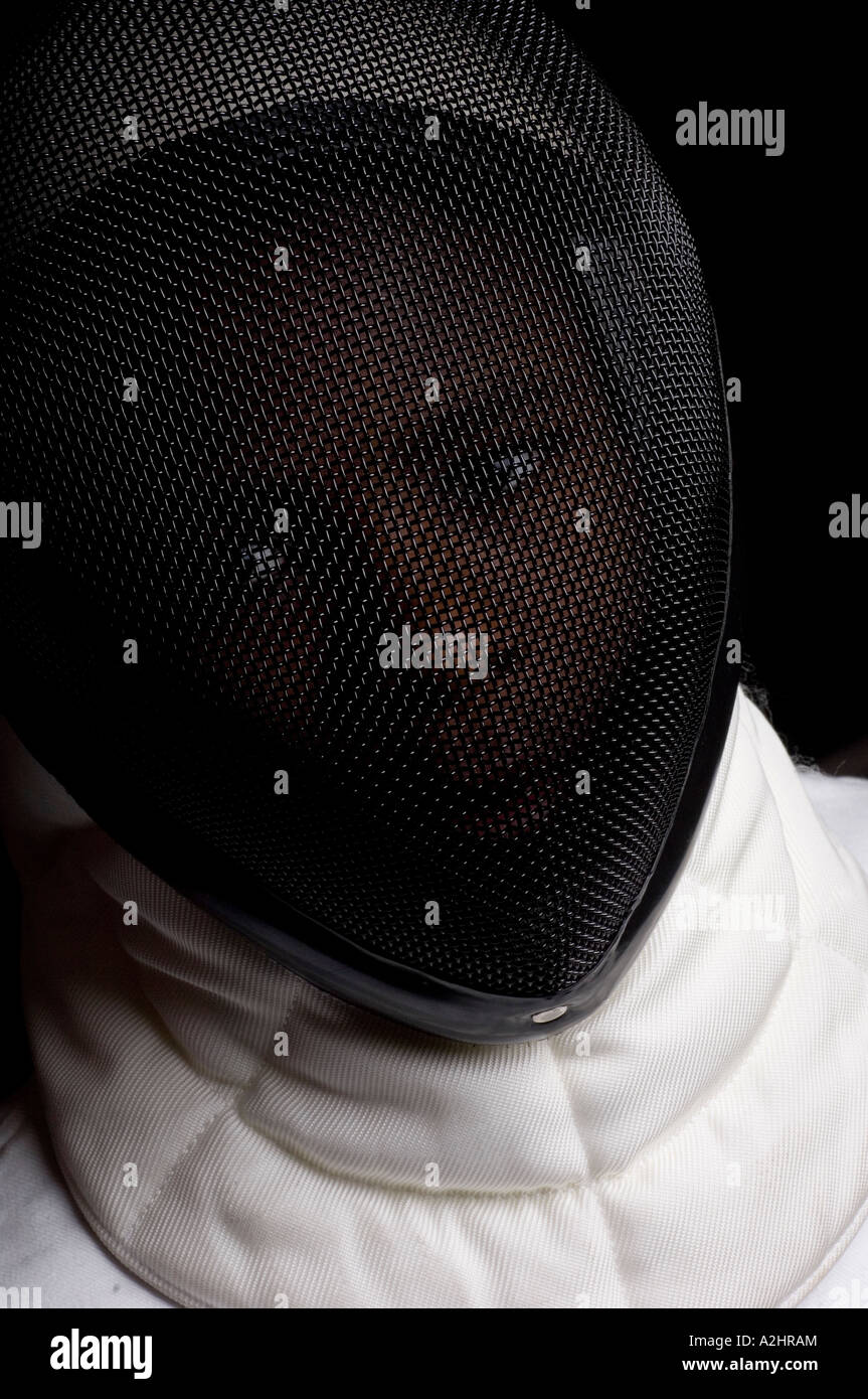 close up of a fencer wearing fencing mask on a black background Stock ...