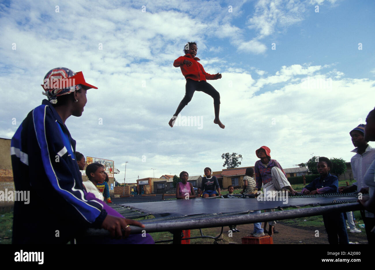 Children playing with trampoline Stock Photo - Alamy
