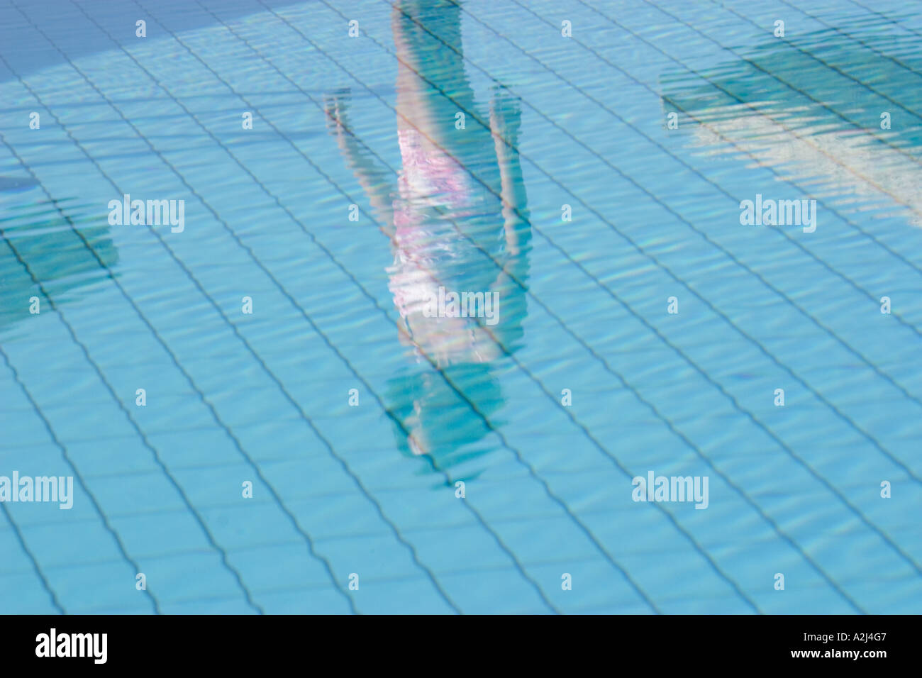 Reflection of Woman in Swimming Pool Stock Photo - Alamy