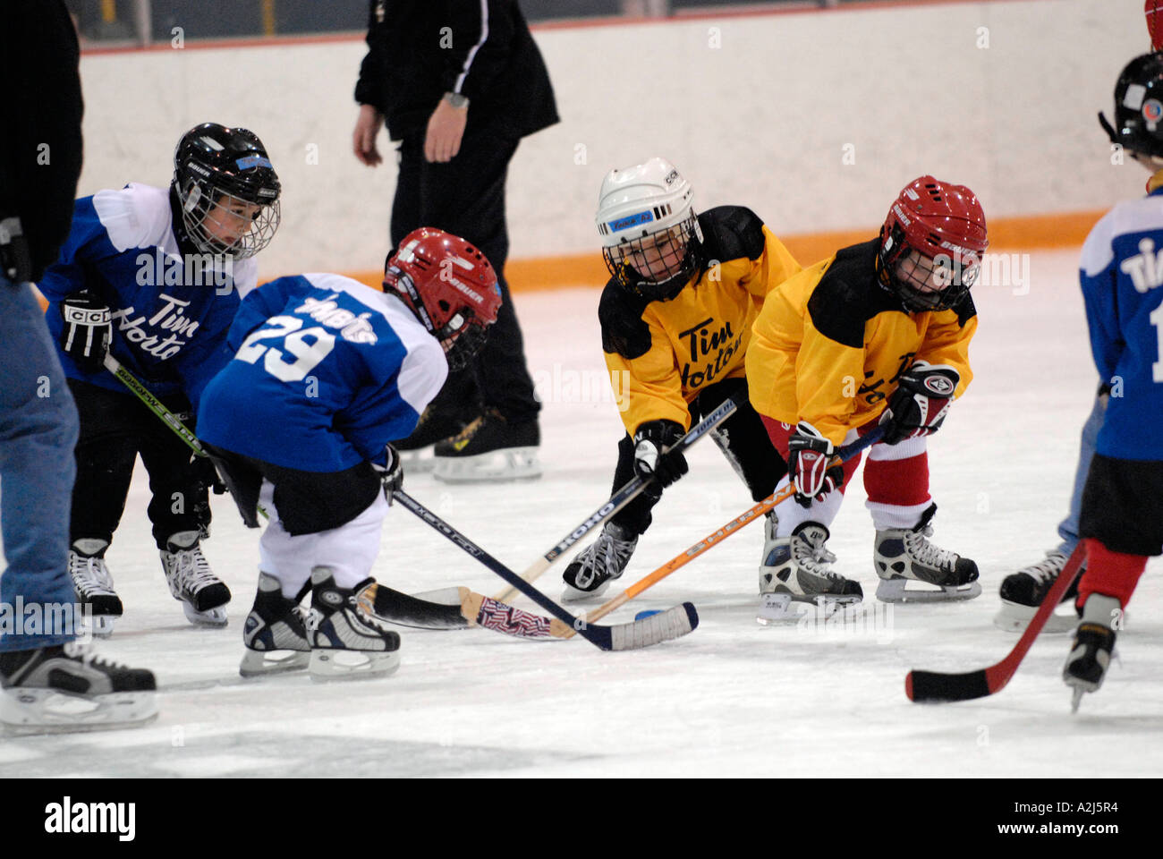 5 year old boys learn how to play the game of ice hockey Stock Photo ...