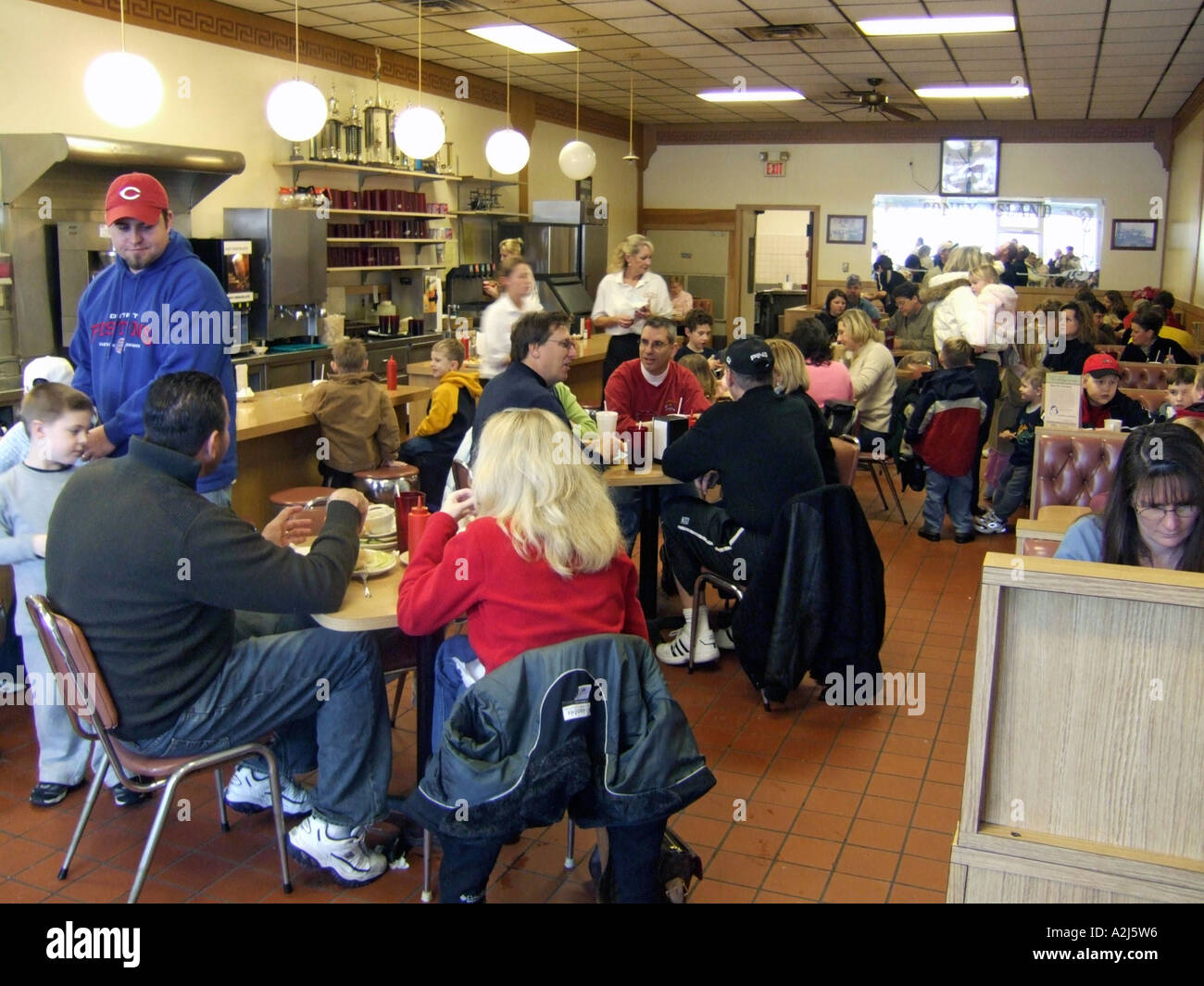 Small local restaurant busy feeding a large group of hungry people ...