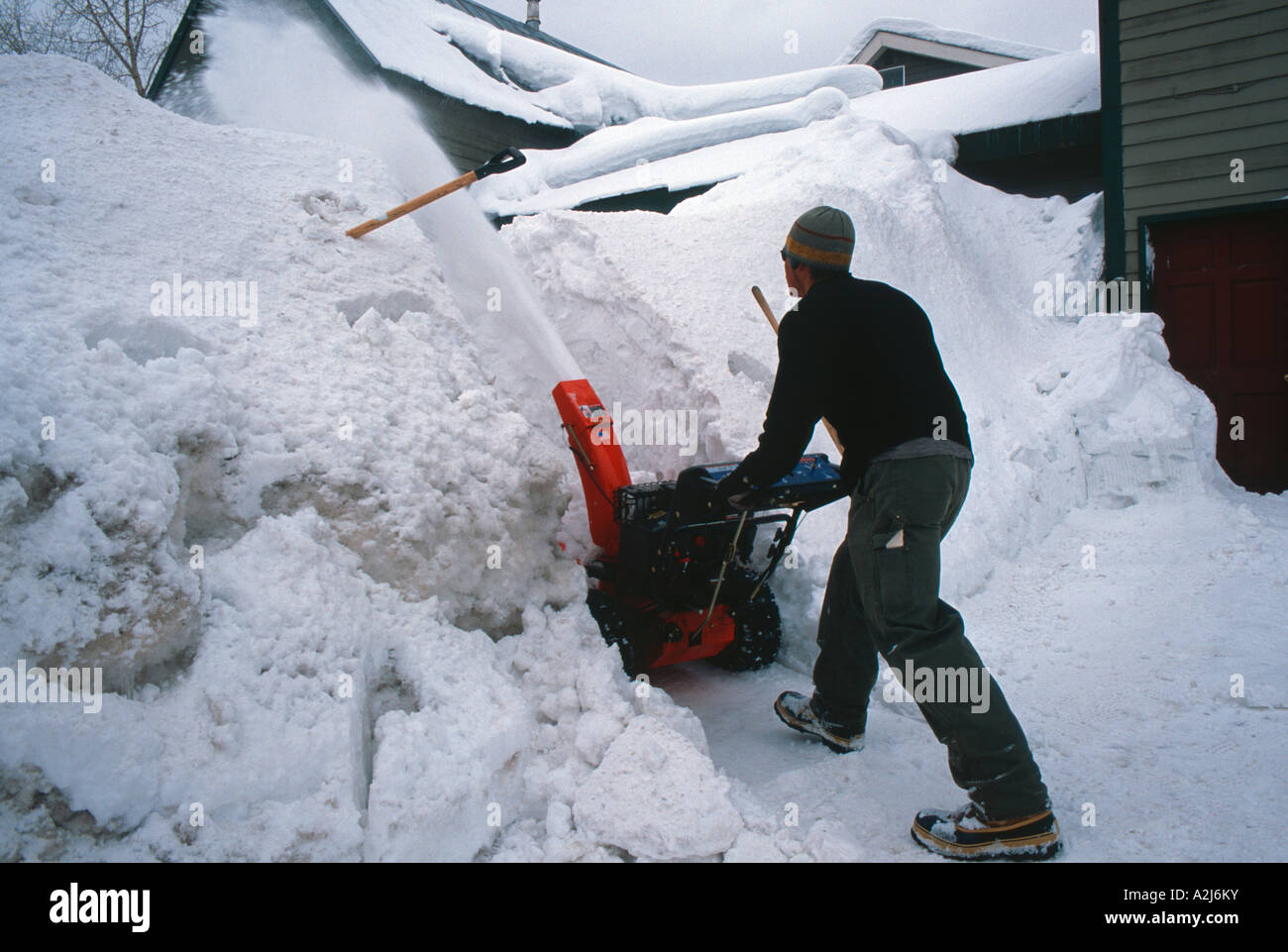 Man using snowblower Colorado USA Stock Photo - Alamy