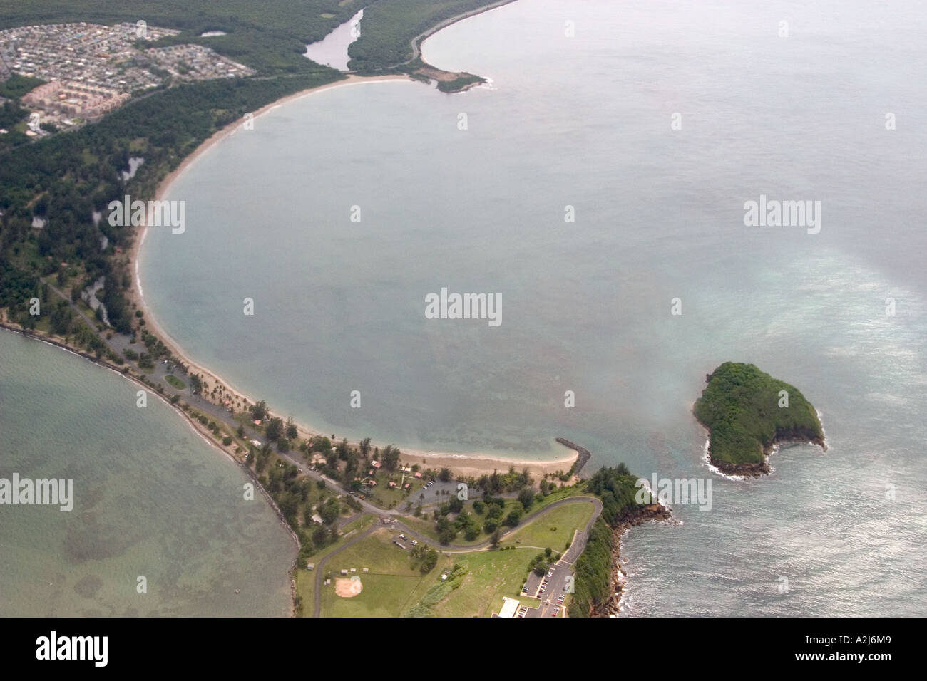 An aerial view shows the coast of Puerto Rico with a peninsula jutting ...