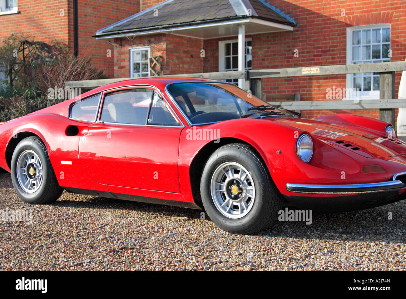 Ferrari Dino 246 GT in red parked on gravel Stock Photo - Alamy