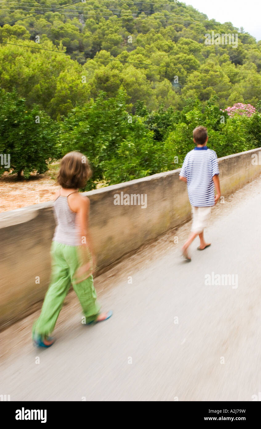boy and girl take a walk in summer Stock Photo - Alamy