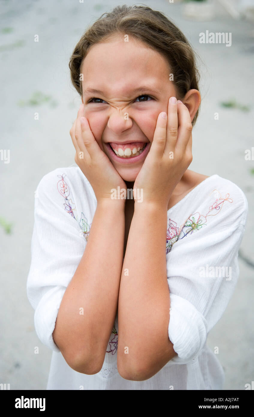 girl holds her ears shut Stock Photo - Alamy