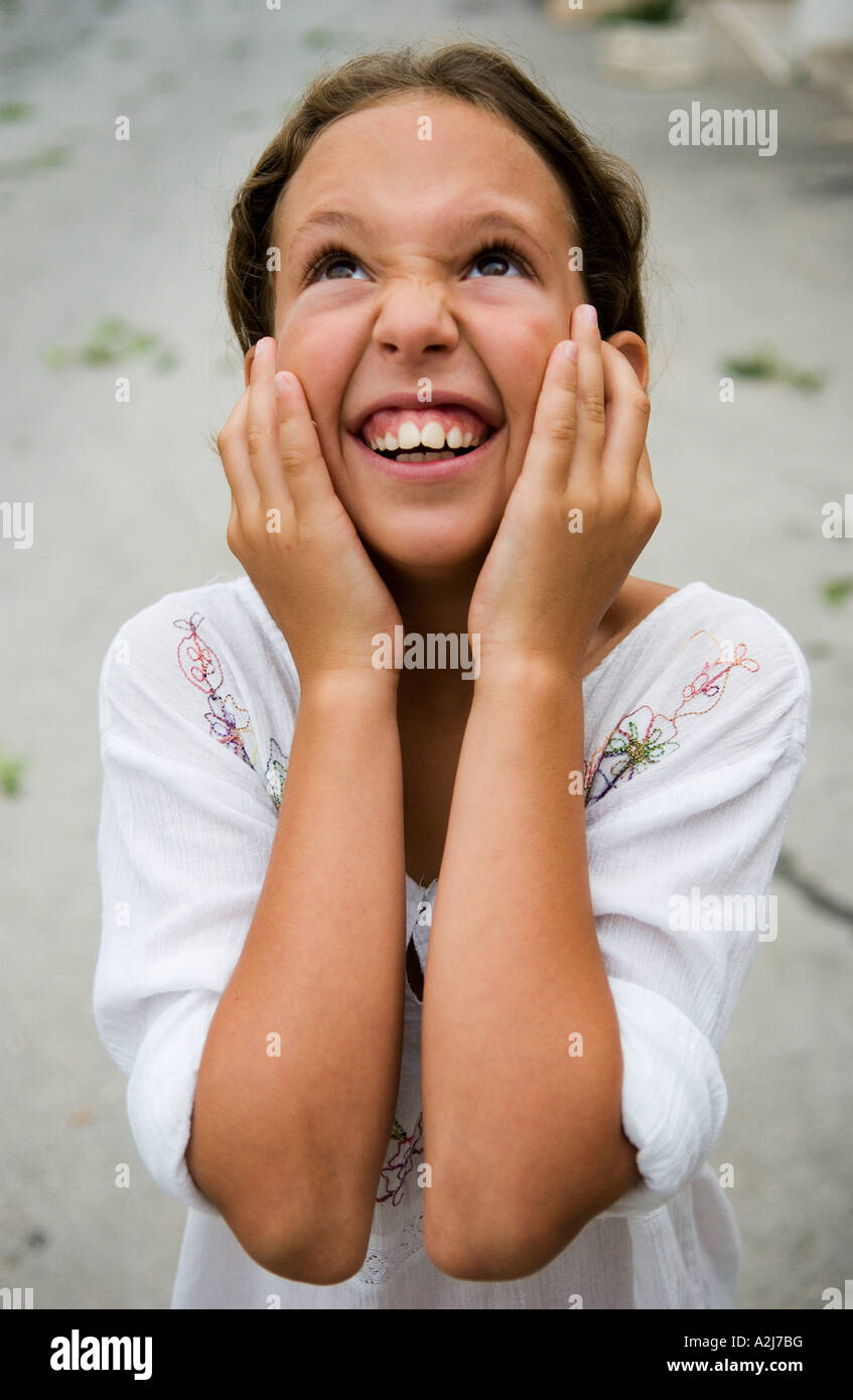 girl holds her ears shut Stock Photo - Alamy