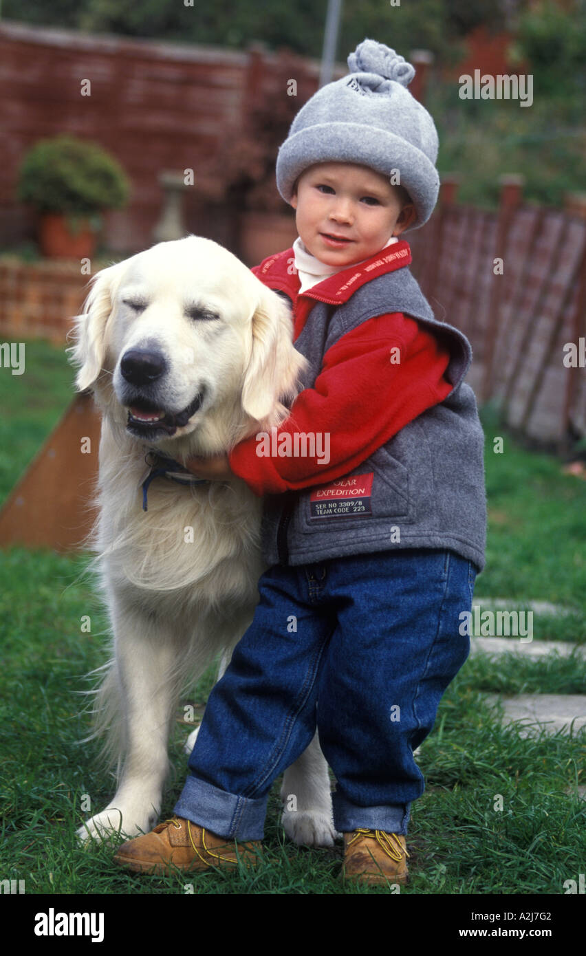 little boy with retriever dog Stock Photo - Alamy