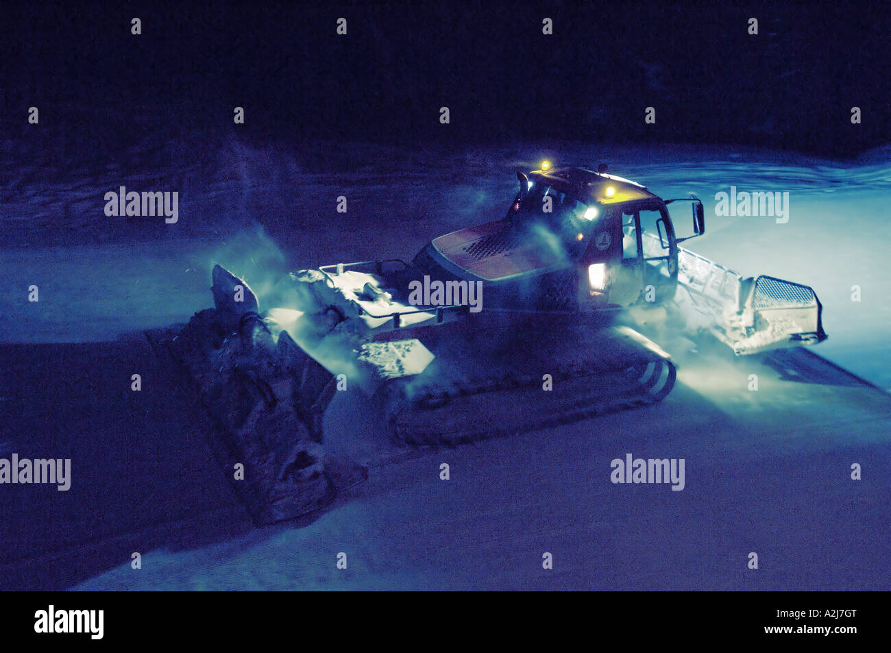 Piste basher at night, French alps Stock Photo - Alamy